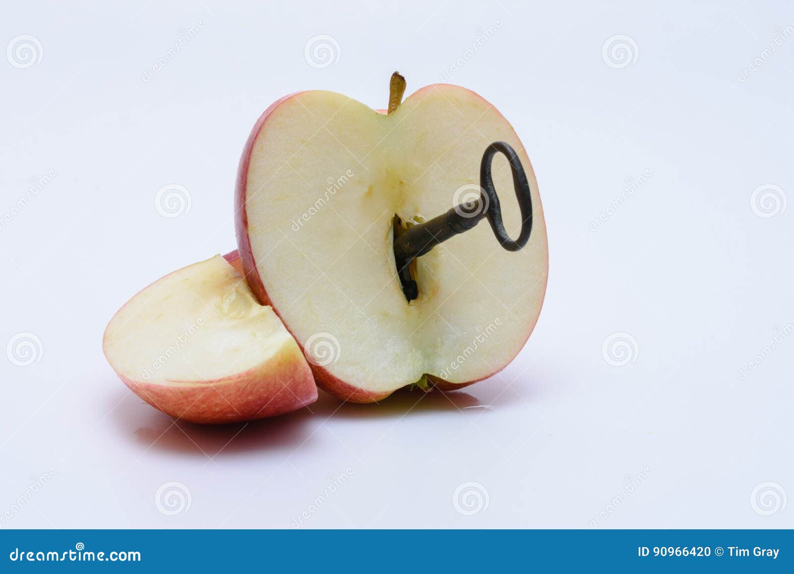 Vintage Key Inserted in Apple Half with Wedges Stock Photo - Image of ...