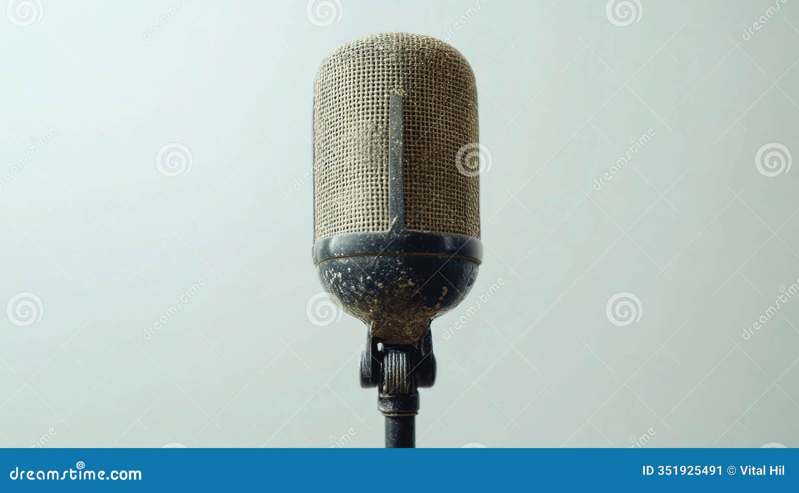 Vintage Microphone on a Simple Background, Showcasing Its Worn Texture ...
