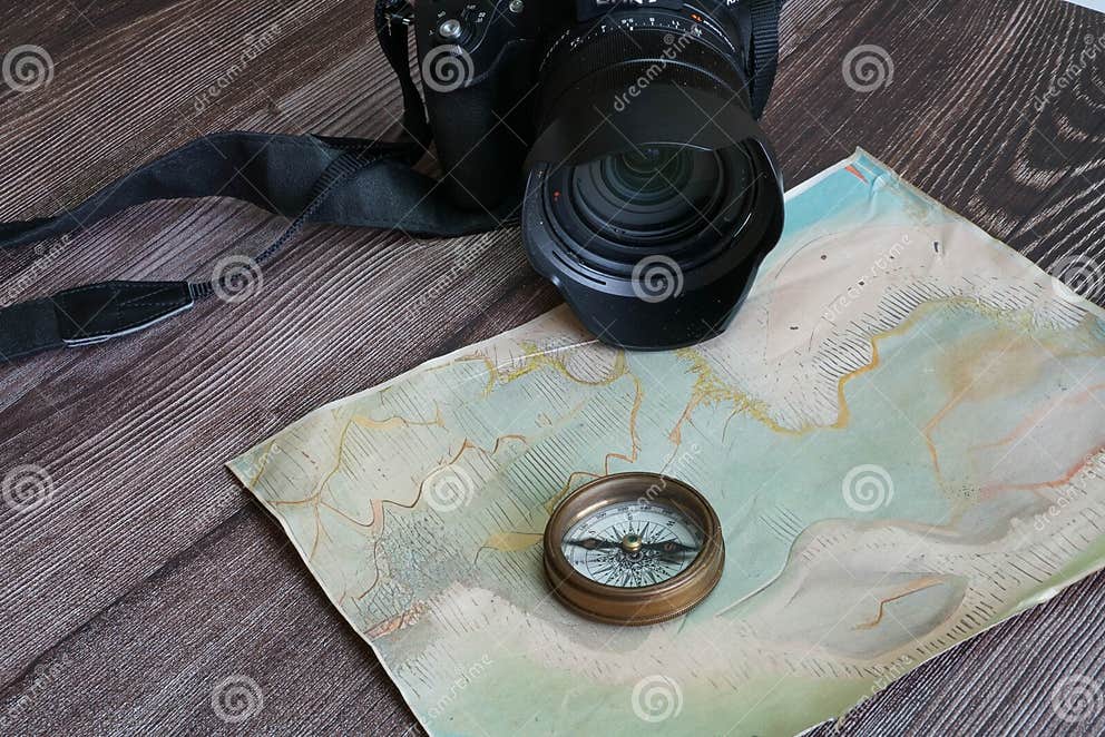 Vintage Navigational Compass with a Camera on a Hand Made Map Stock ...
