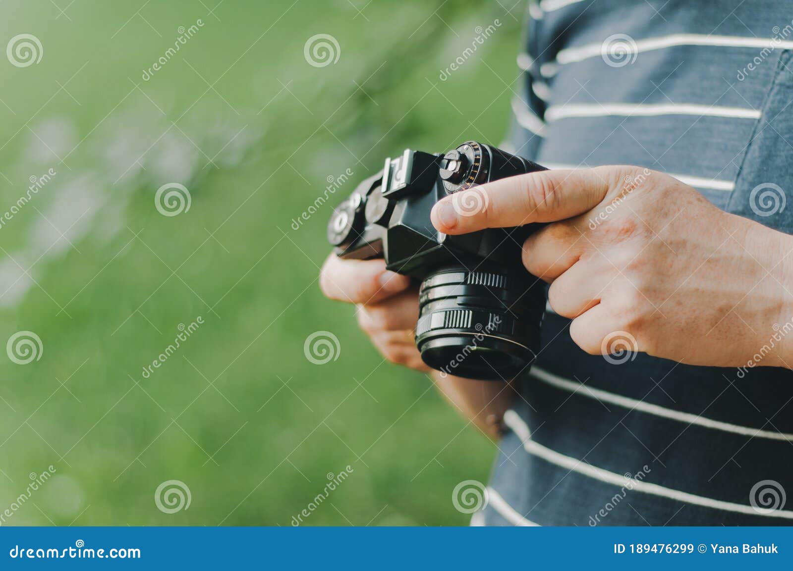Vintage old camera in hand stock image. Image of equipment - 189476299