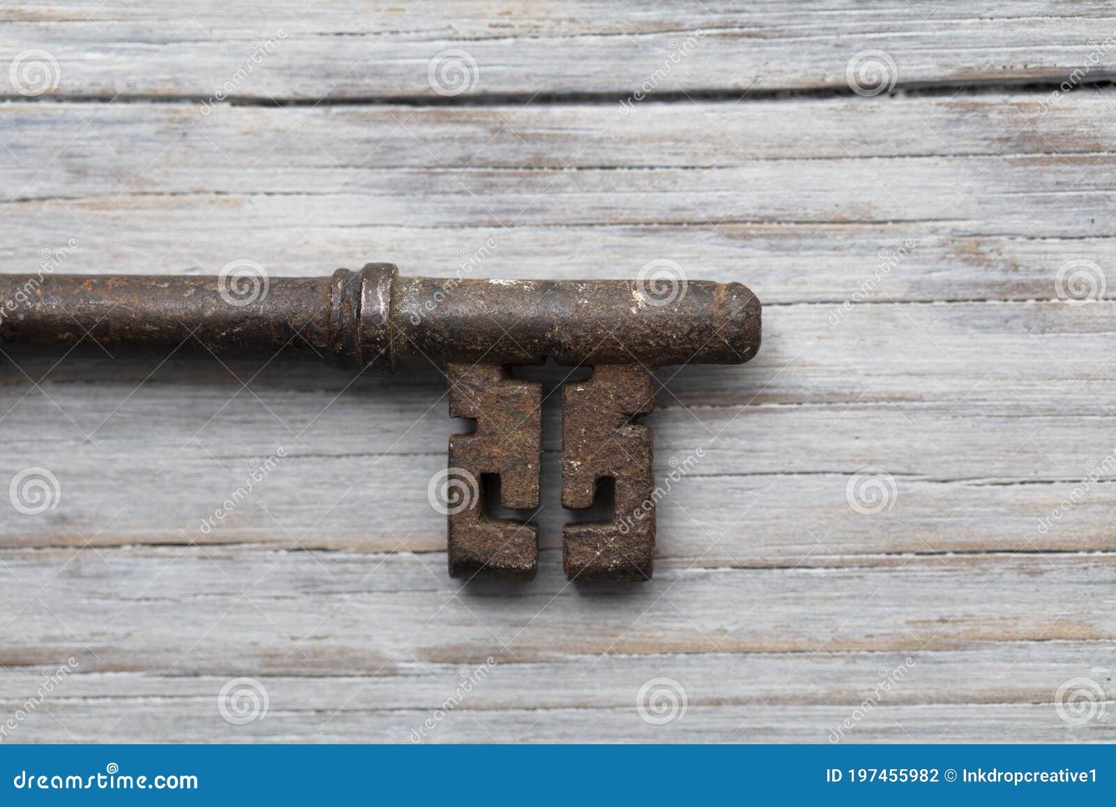 Vintage Old Fashioned Key on a Rustic Wooden Background. Security ...