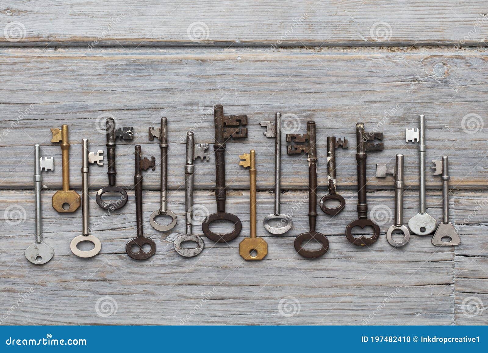 Old Fashioned Keys On Wooden Aged Background With Frame Concept Stock ...
