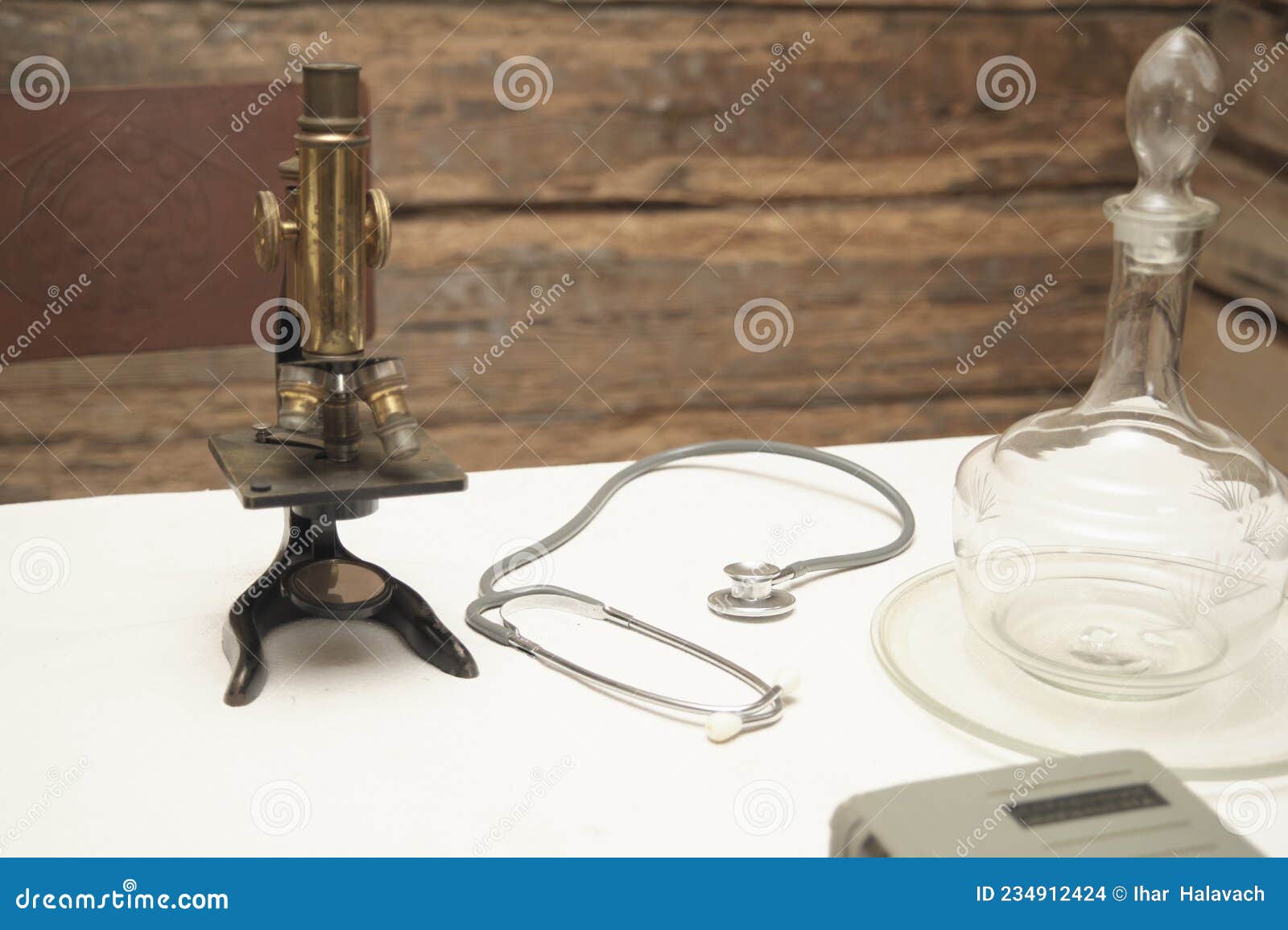 Vintage Old Microscope on the Table for Science Next To a Bottle for ...