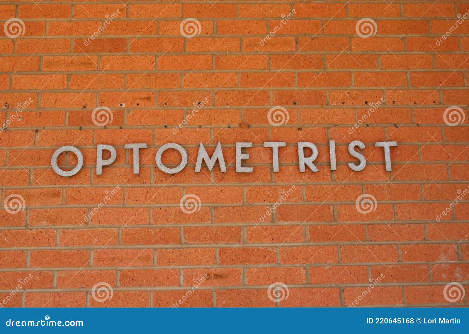 Vintage Optometrist Sign on Red Brick Wall Stock Photo - Image of ...