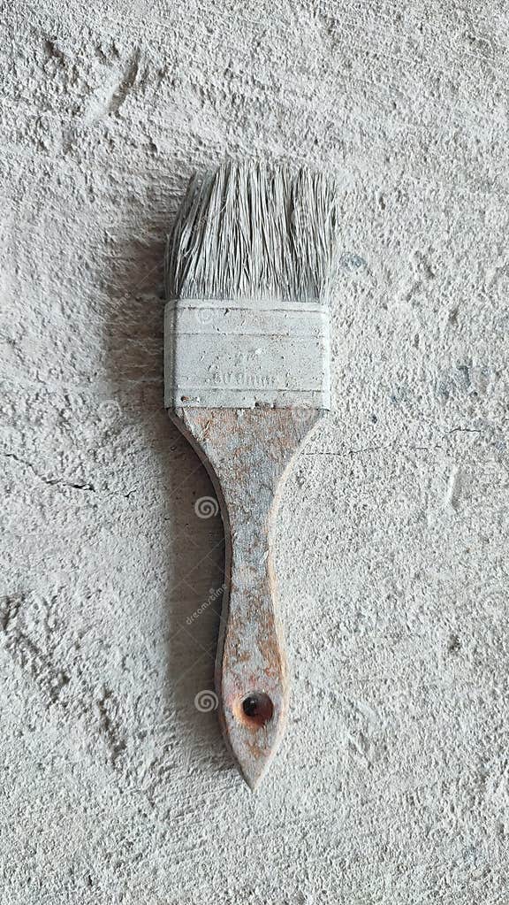 A Vintage Paint Brush Resting on a Textured Surface Stock Photo - Image ...