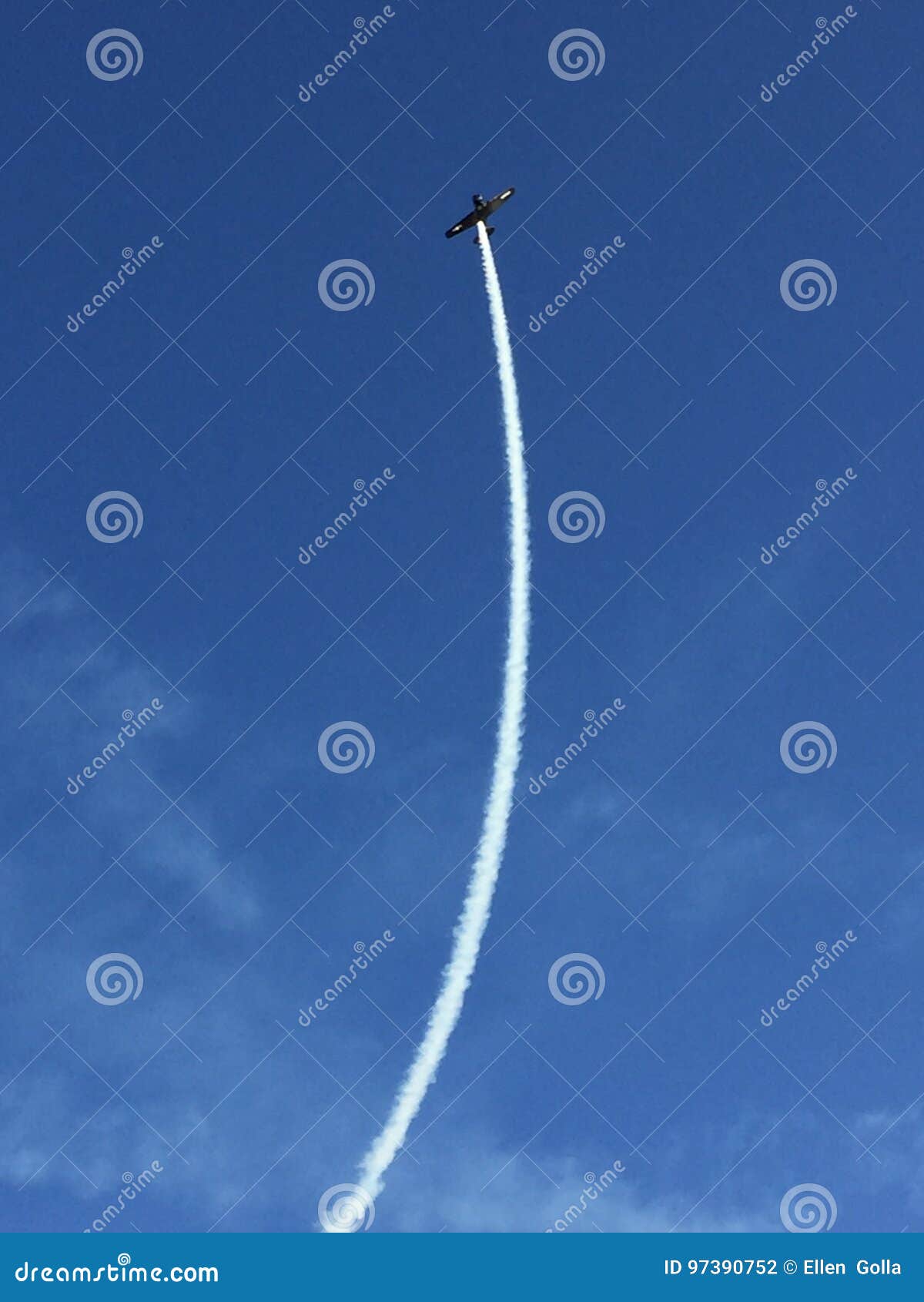 Jet Plane And Vapor Trails Going Straight Up Across A Deep Blue Sky And ...