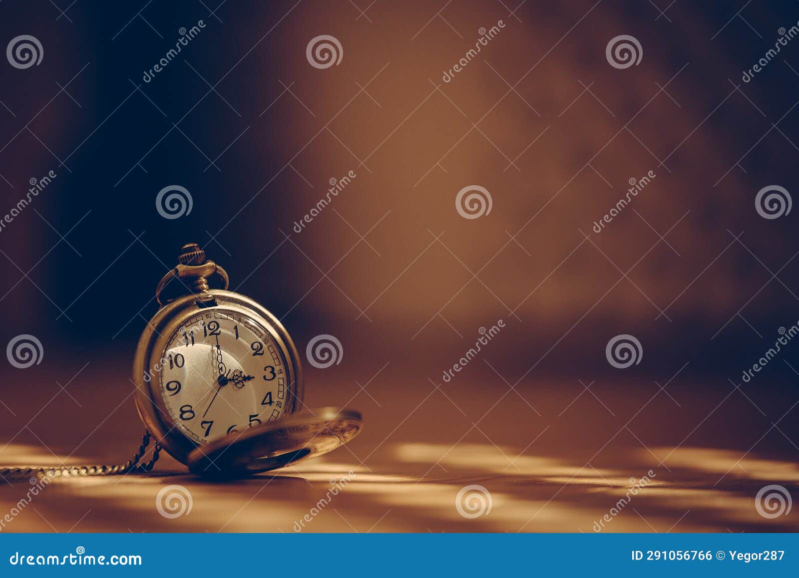 Vintage Pocket Watch in Shade Lit by Sun Ray Stock Photo - Image of ...
