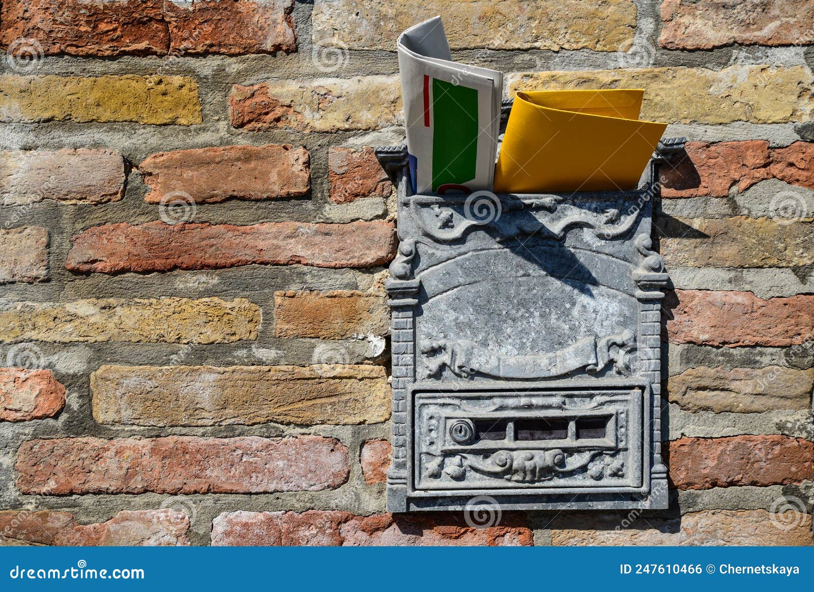 Vintage Post Box with Newspaper and Letter on Old Brick Wall. Space for ...