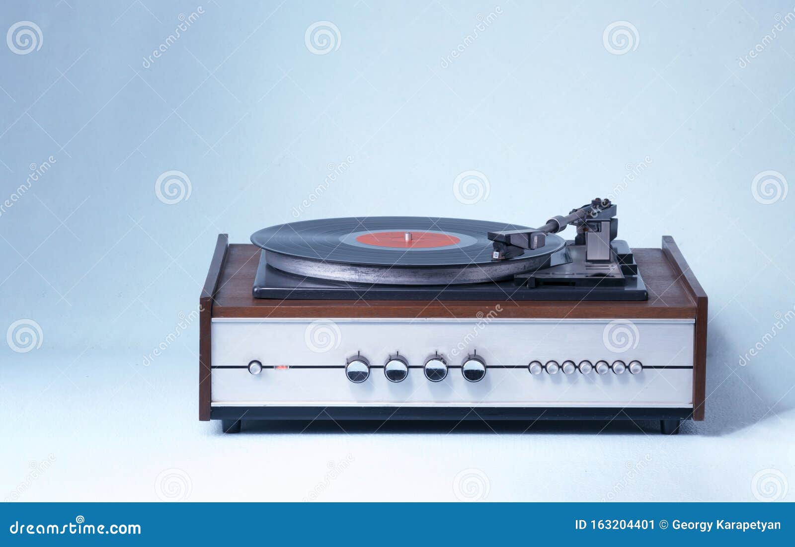 Vintage Record Player and Vinyl Record on a Blue Background. Retro ...