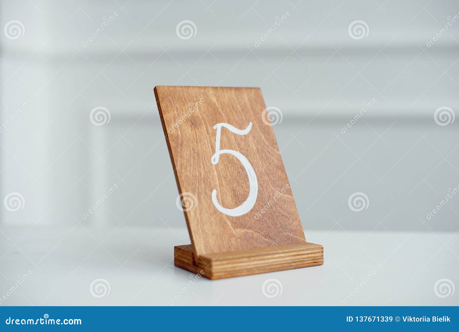 Vintage Rectangular Shaped Wooden Number Buttons on a White Wooden ...