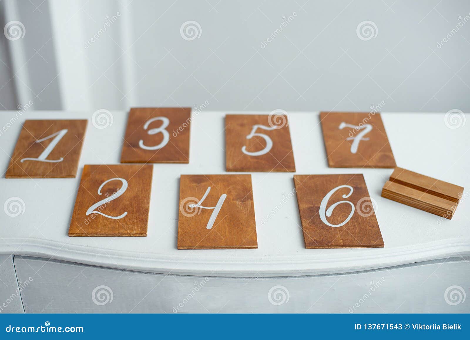 Vintage Rectangular Shaped Wooden Number Buttons on a White Wooden ...