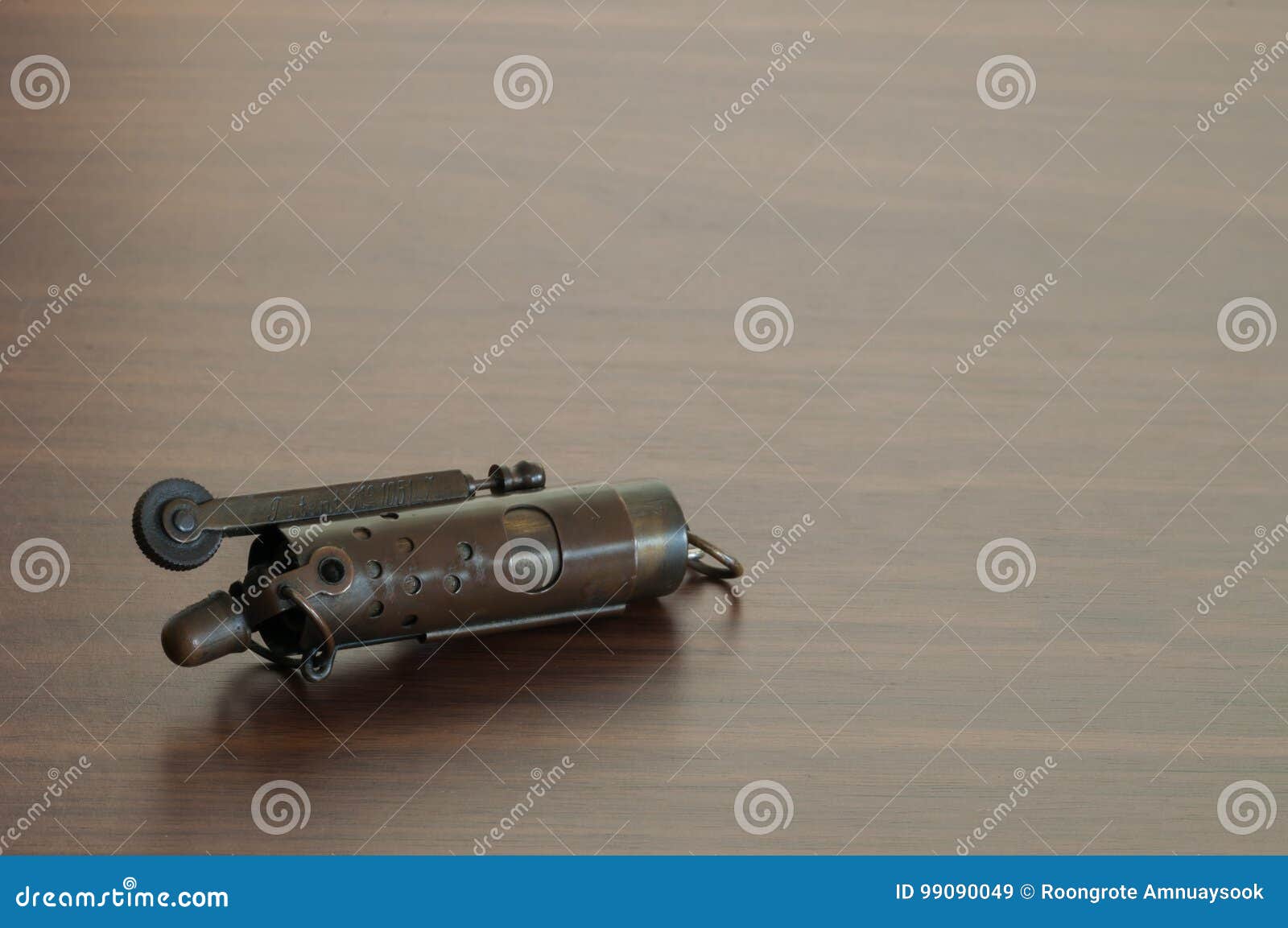 Vintage Retro Scratched Lighter on Wooden Table Stock Image - Image of ...