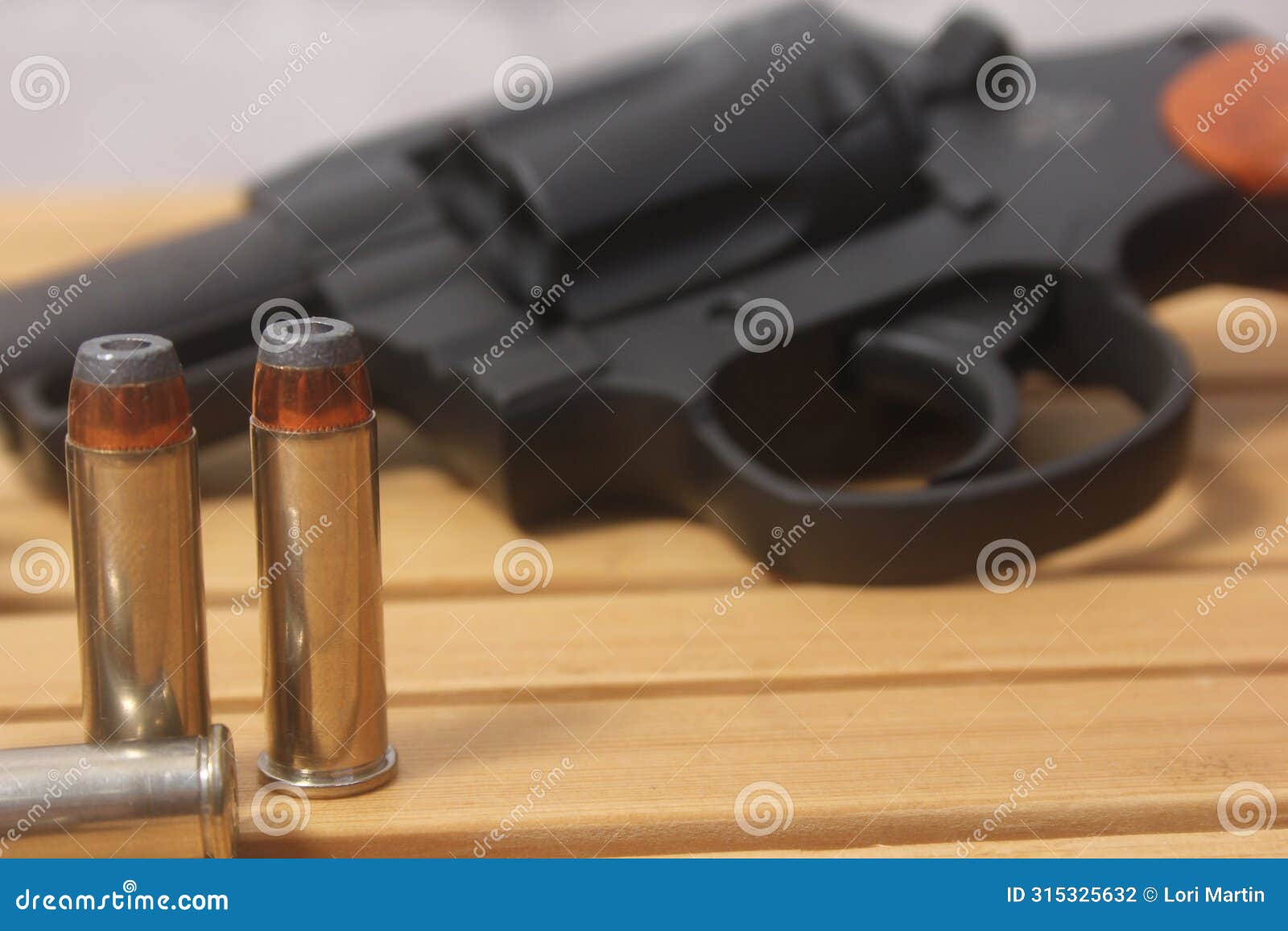 Vintage Revolver Gun with Ammunition and Speed Loader Stock Photo ...