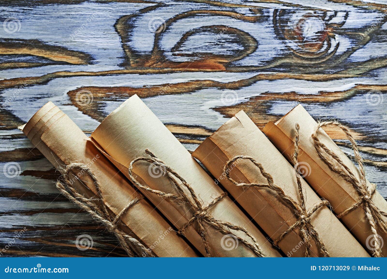 Vintage Rolled Paper Scrolls on Wooden Board Stock Image - Image of ...
