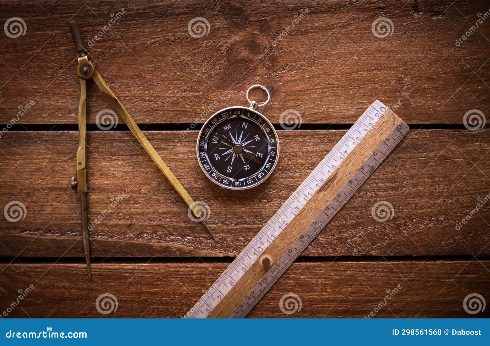 Vintage Rule, Drawing and Navigational Compass on a Rustic Wooden Board ...