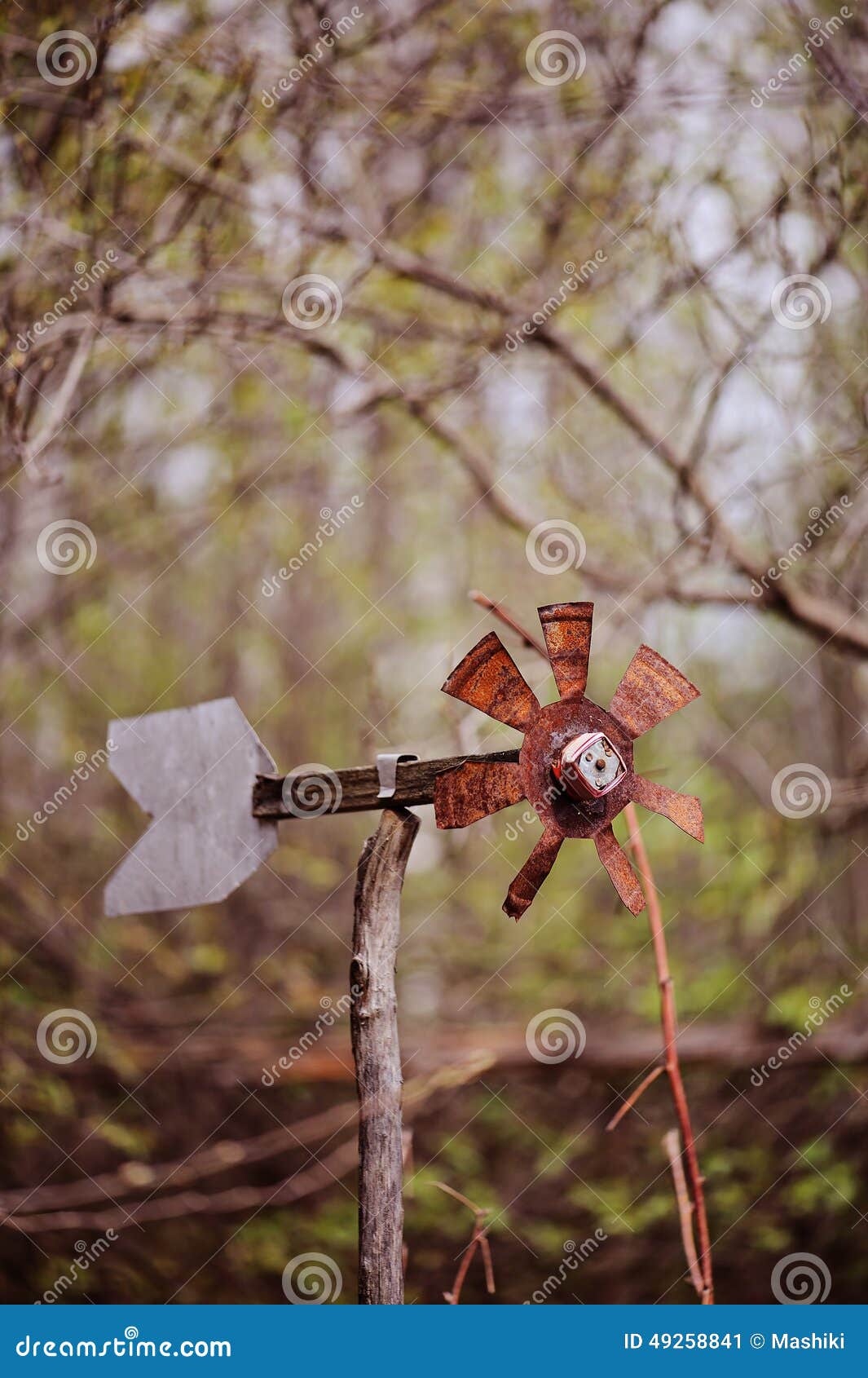Vintage Rustic Windmill in Early Spring Garden Stock Image - Image of ...