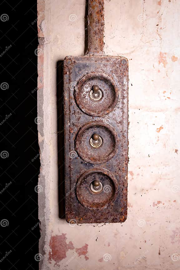Vintage Rusty Triple Light Switch Panel from Urbex Exploration. Stock ...
