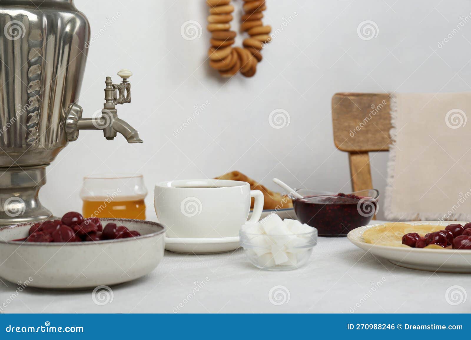 Vintage Samovar Cup Of Hot Drink And Snacks Served On Table