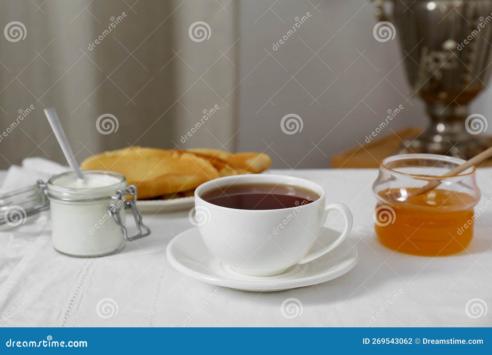 Vintage Samovar Cup Of Hot Drink And Snacks Served On Table