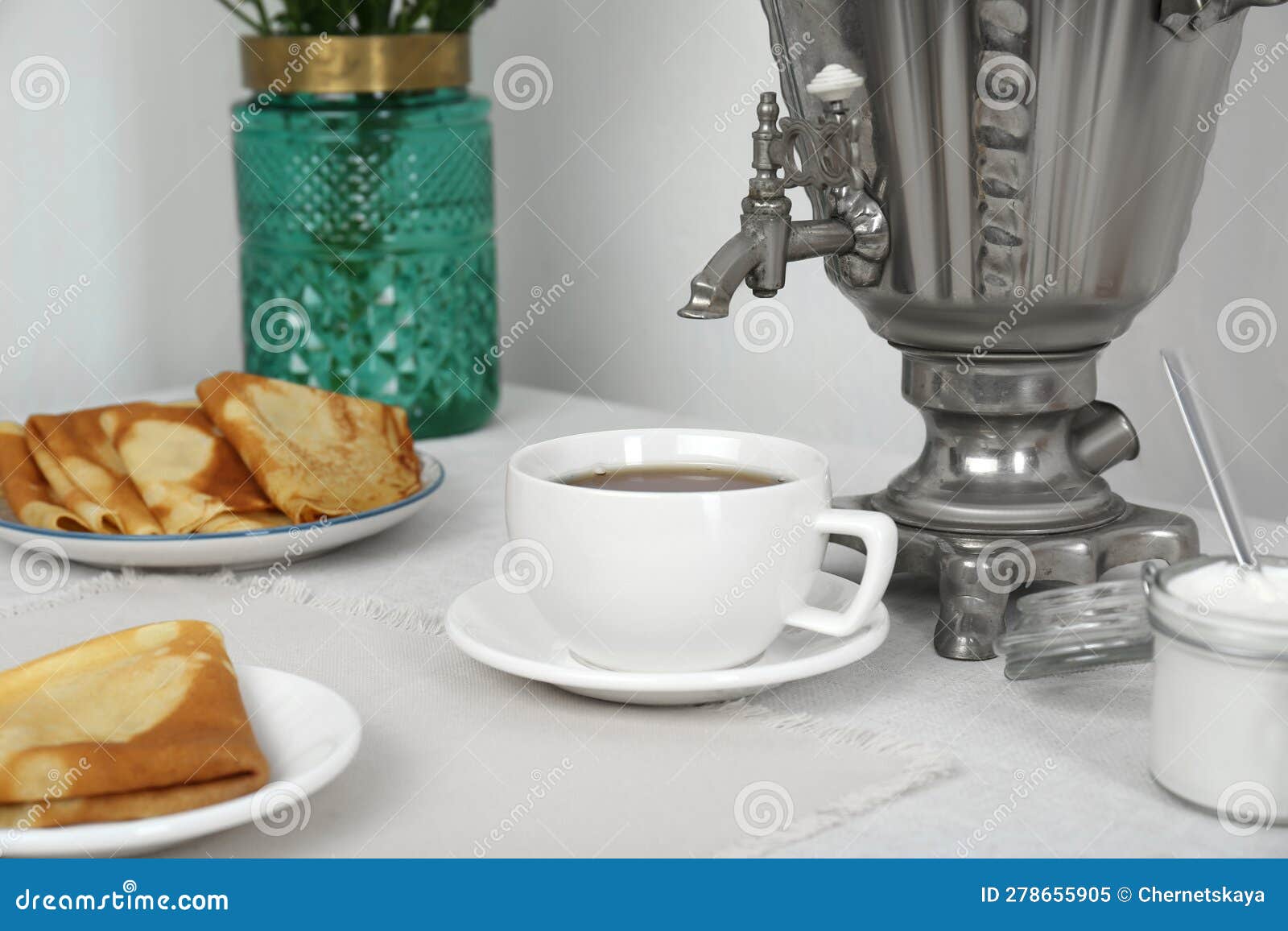 Vintage Samovar Cup Of Hot Drink And Snacks Served On Table