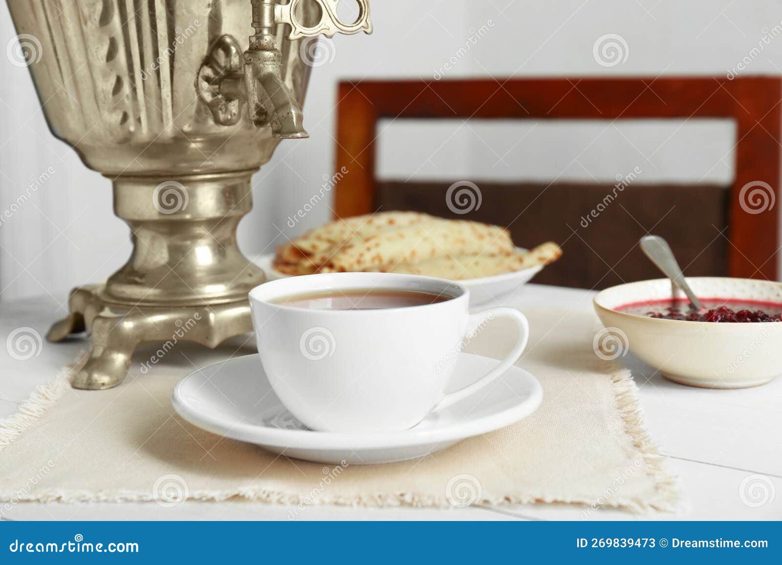 Vintage Samovar Cup Of Hot Drink And Snacks Served On White Wooden