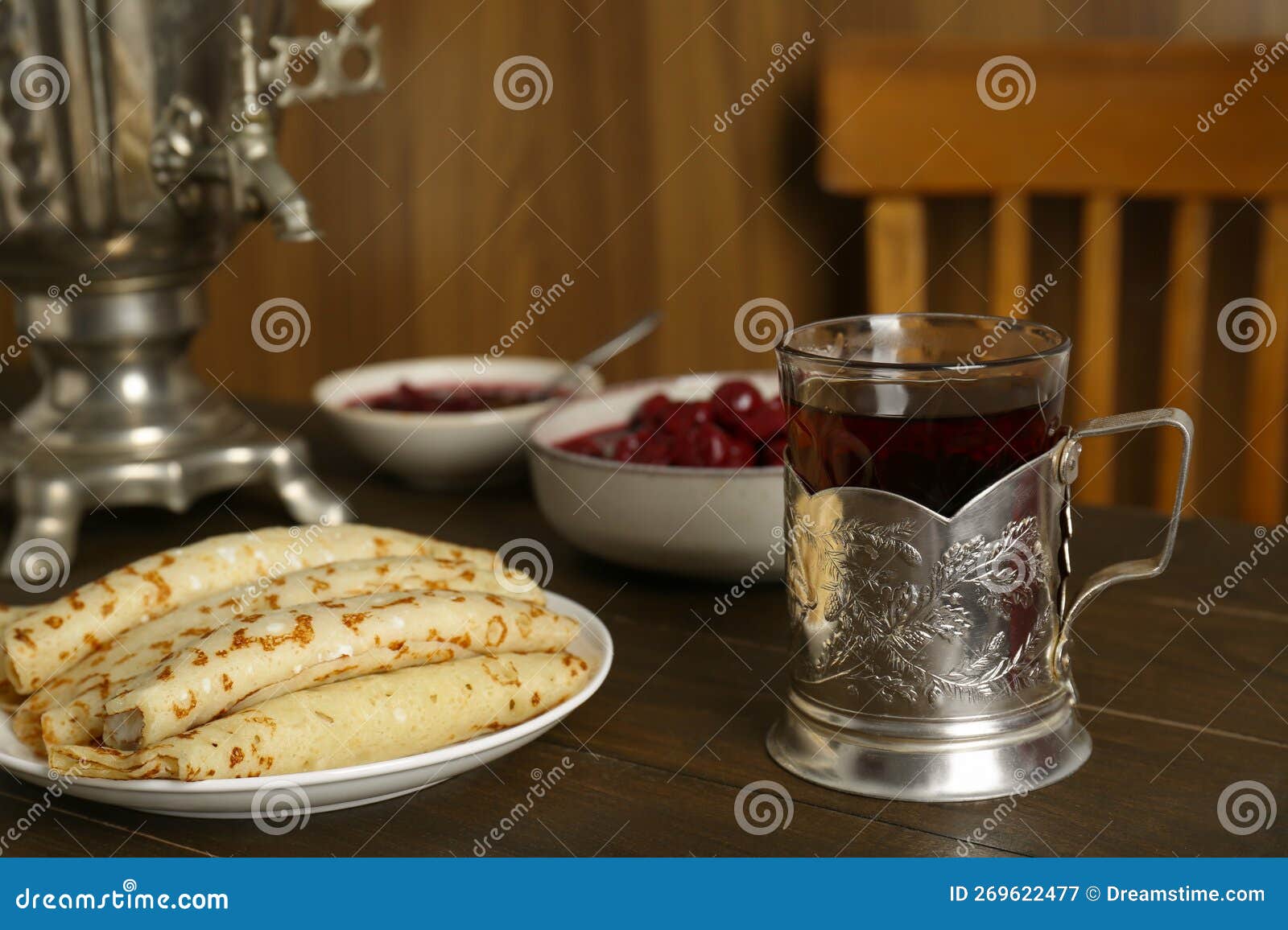 Vintage Samovar Cup Of Hot Drink And Snacks Served On Wooden Table
