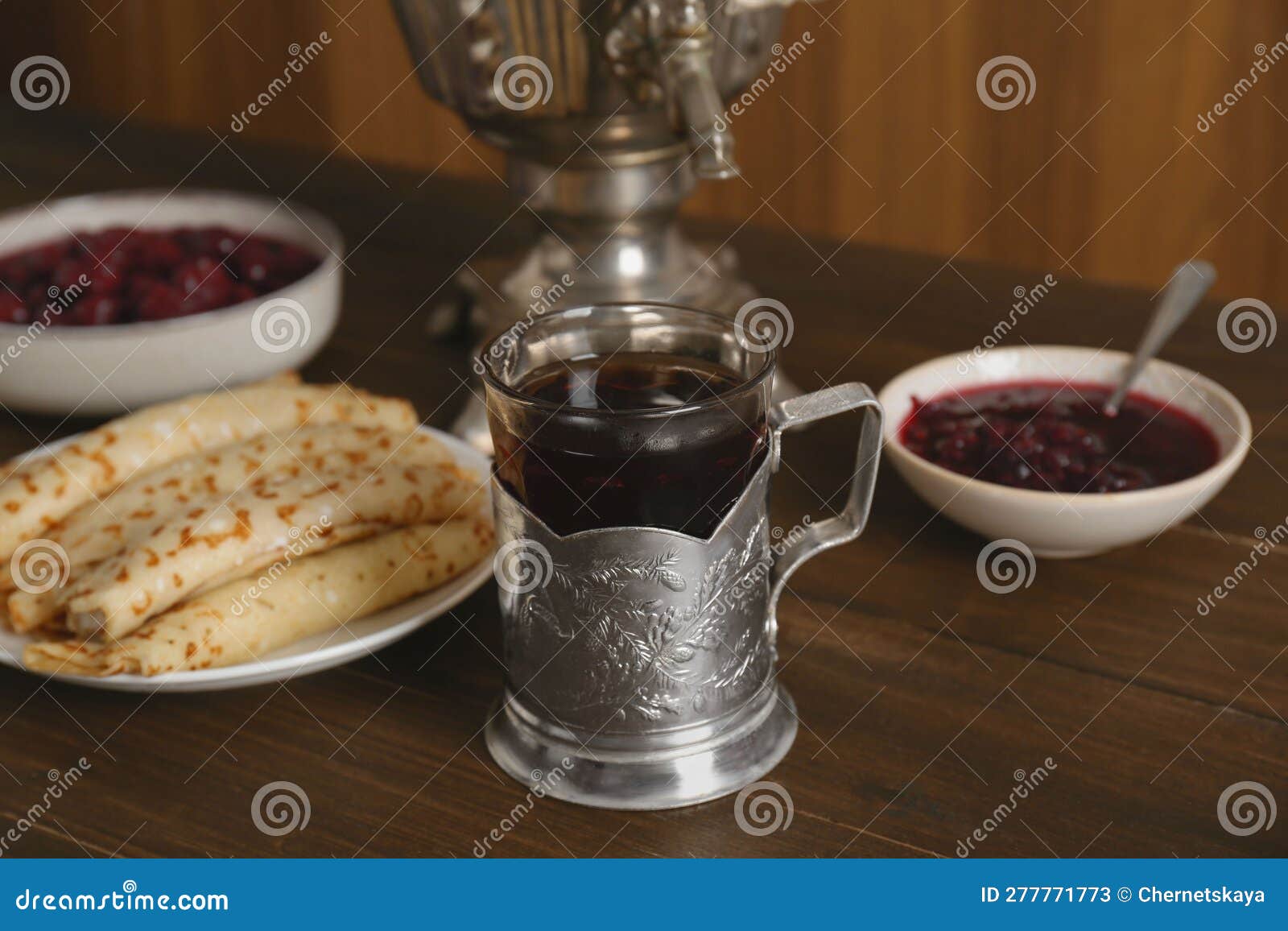 Vintage Samovar Cup Of Hot Drink And Snacks Served On Wooden Table