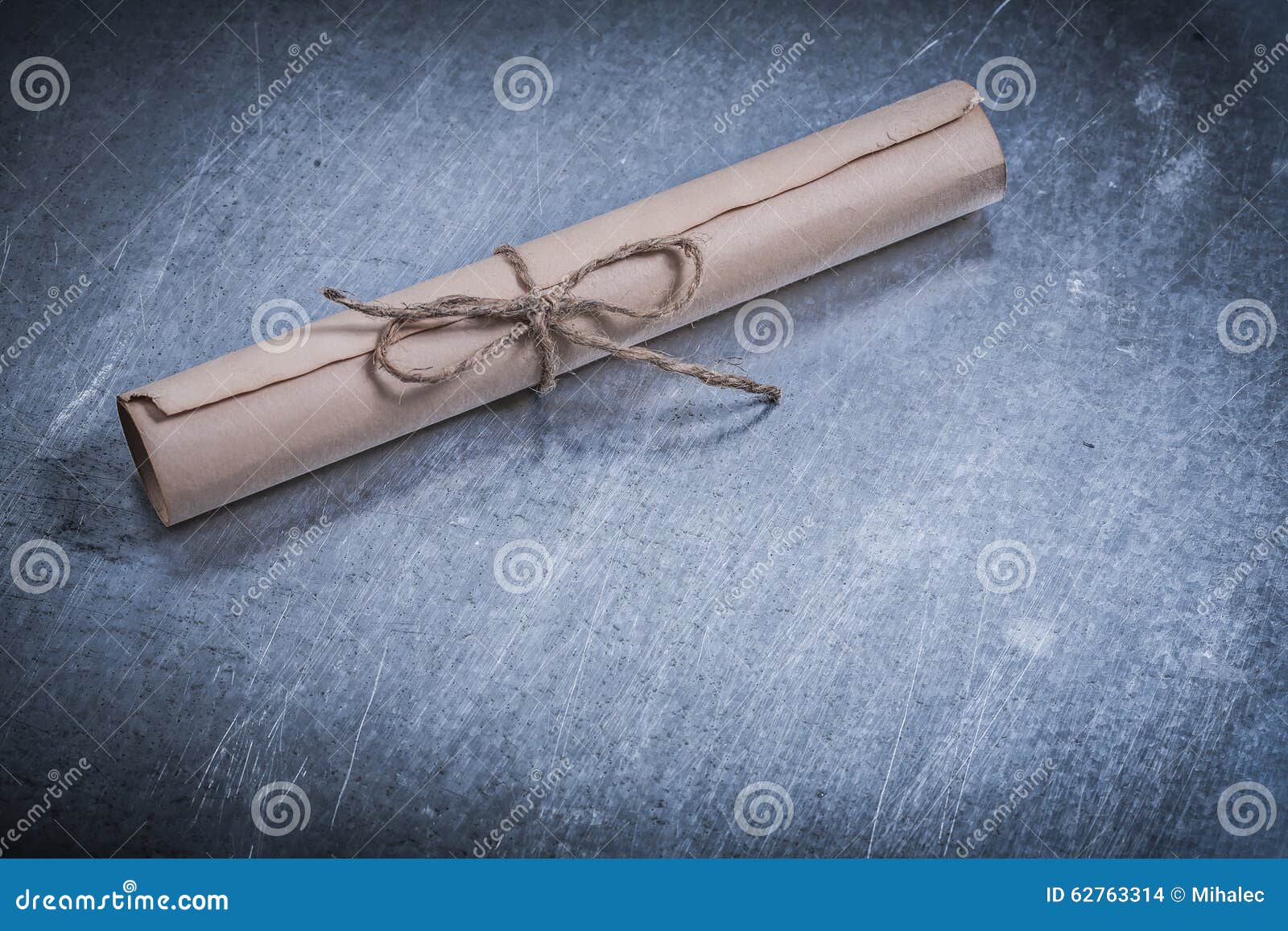 Vintage Scroll of Paper on Scratched Metallic Stock Photo - Image of ...