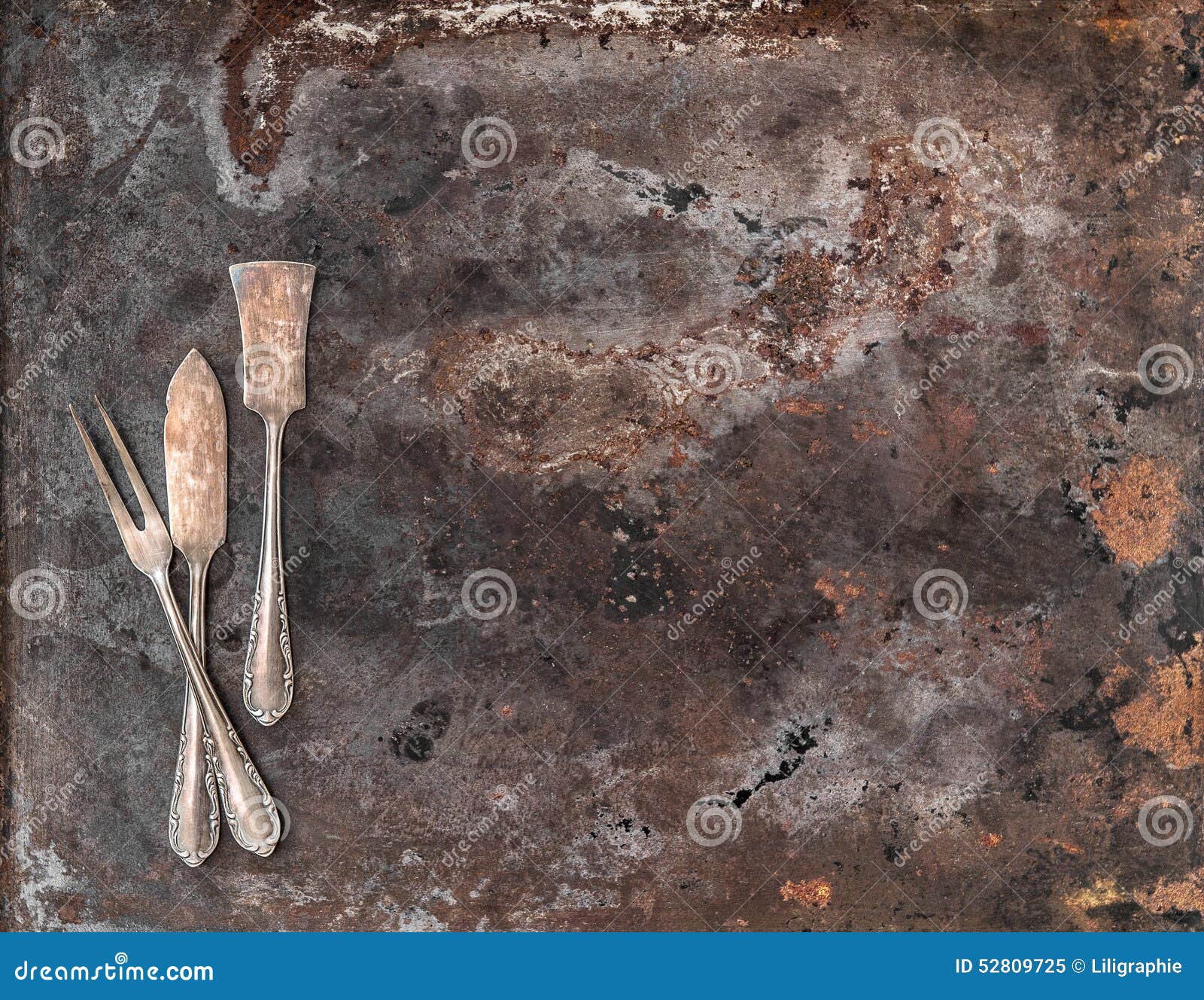 Vintage Silver Cutlery on Rustic Textured Metal Background Stock Image ...