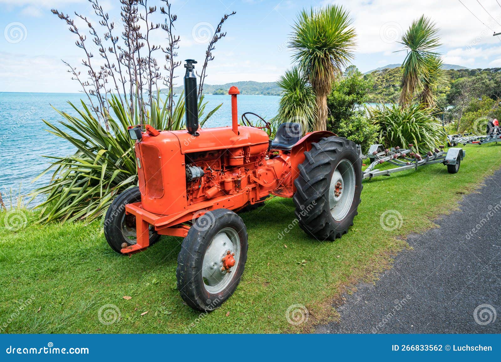 Vintage Small Red Tractor by the Lake Stock Photo - Image of earth ...