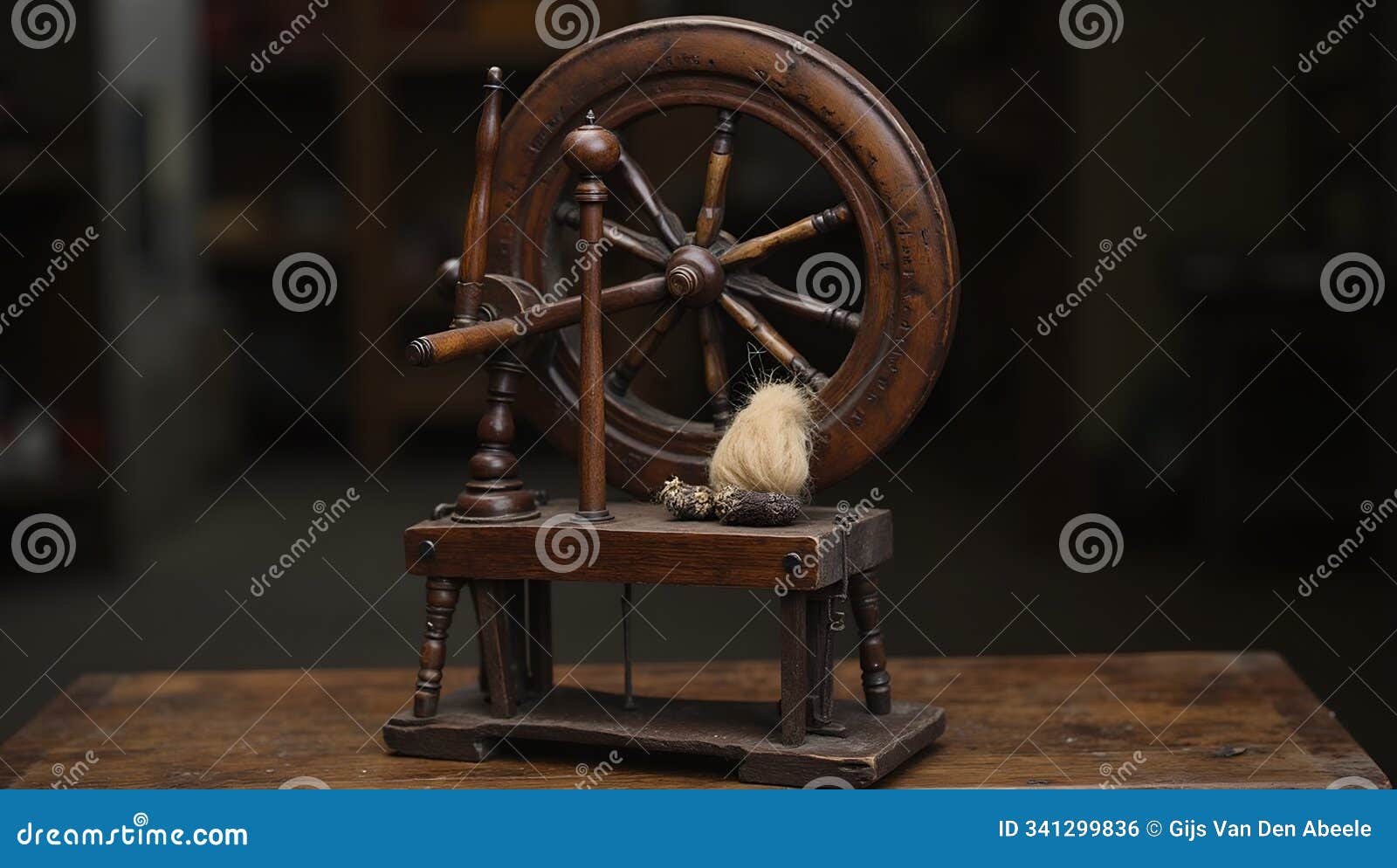 Vintage Spinning Wheel with Intricate Carvings and Wool Thread on ...