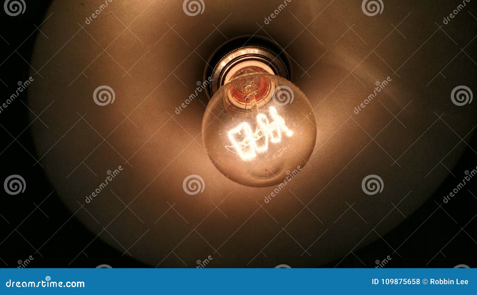 Filament Inside Warm Light Bulb Stock Photo - Image of filament, glass ...