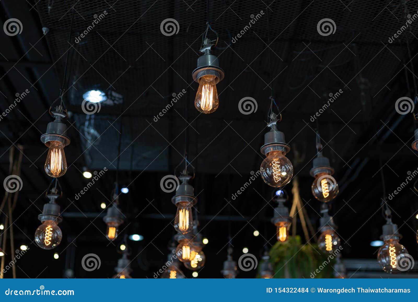 Vintage Style Light Bulb in a Cafe Shop Stock Photo - Image of ...