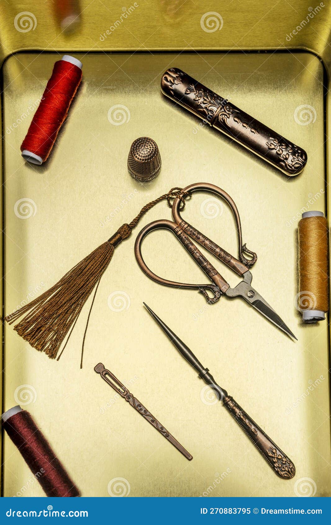 Vintage Style Sewing Utensils with Scissors, a Thimble and Spools of ...