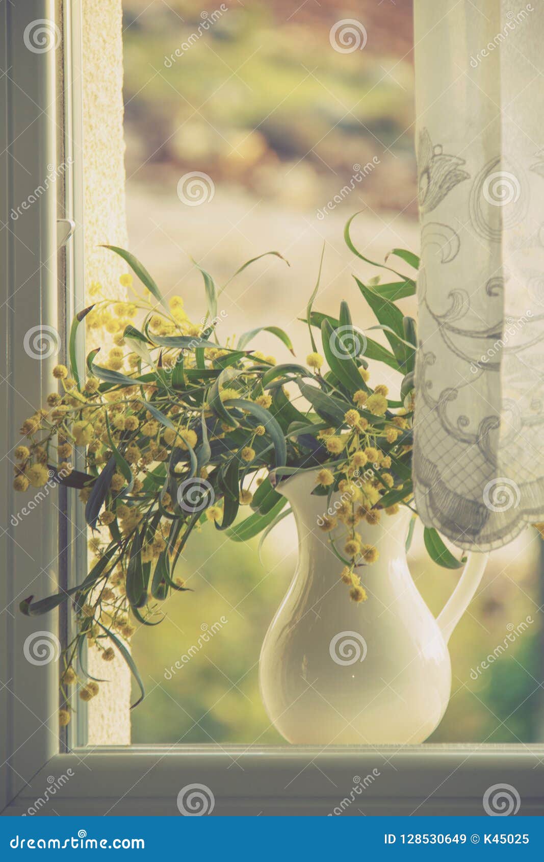Vintage Styled Image - Pitcher with Yellow Flowers on the Window Stock ...