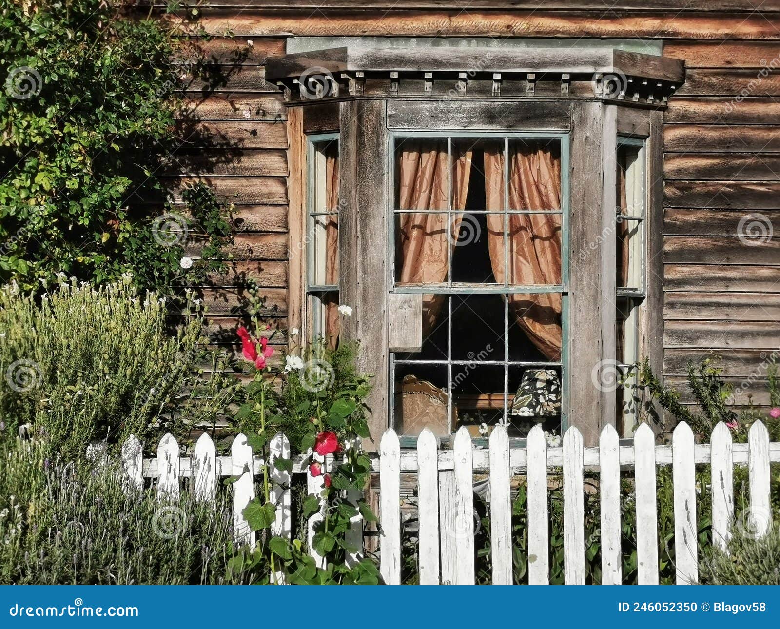 A Vintage Styled Window with White Fence on the Foreground Stock Photo ...