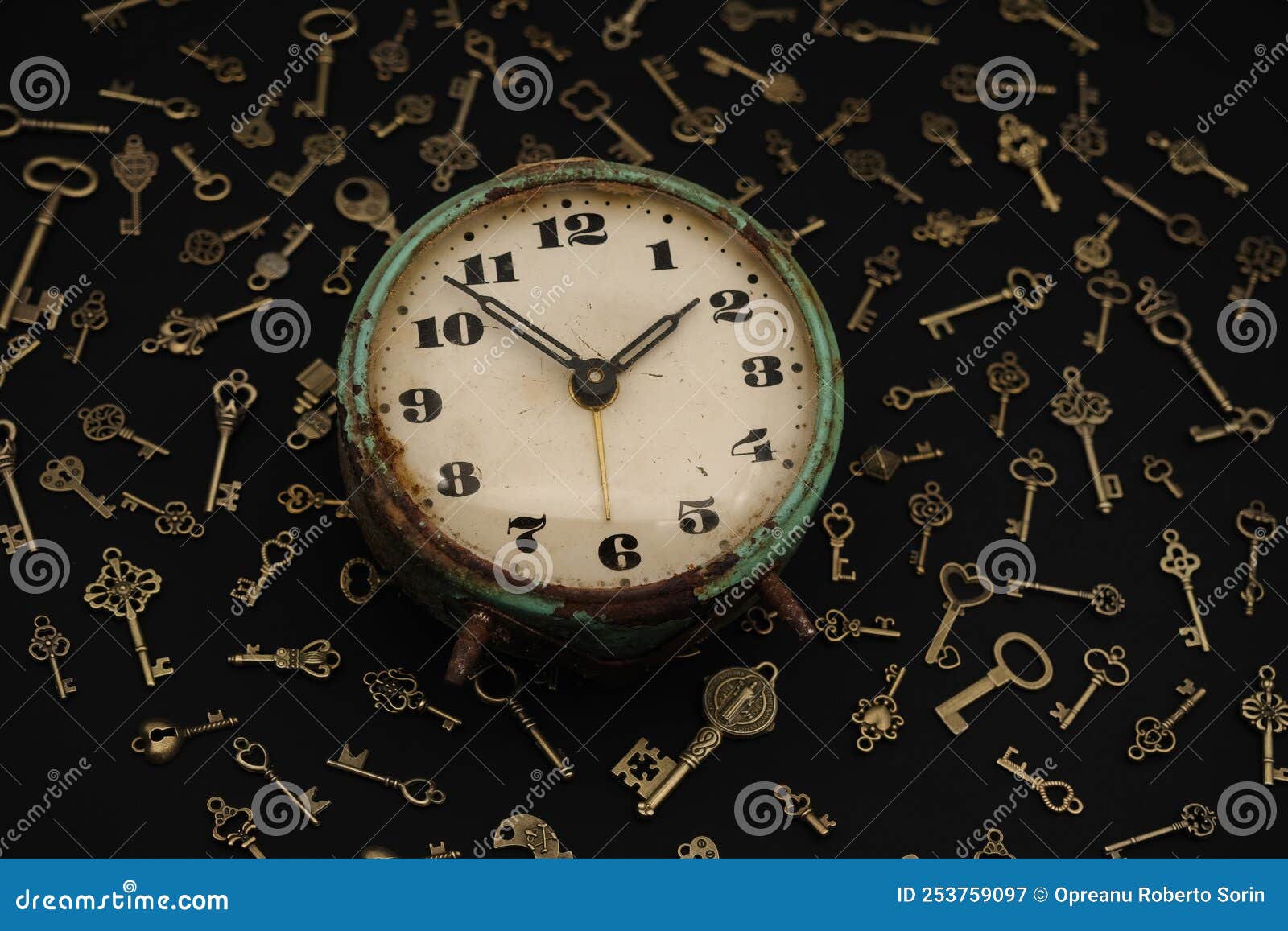 Vintage Table Clock on Ornamental Keys Background Stock Image - Image ...