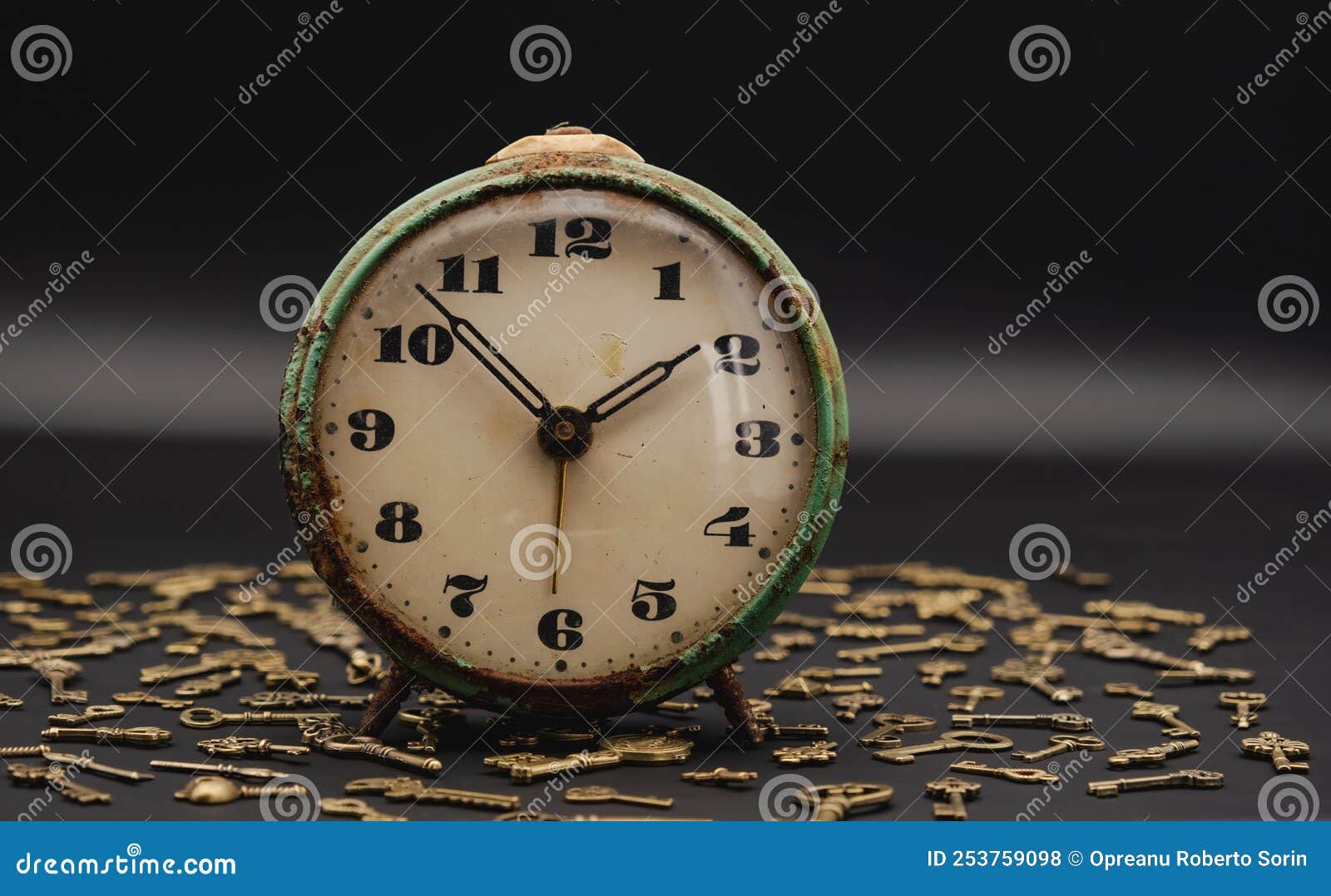 Vintage Table Clock on Ornamental Keys Background Stock Photo - Image ...