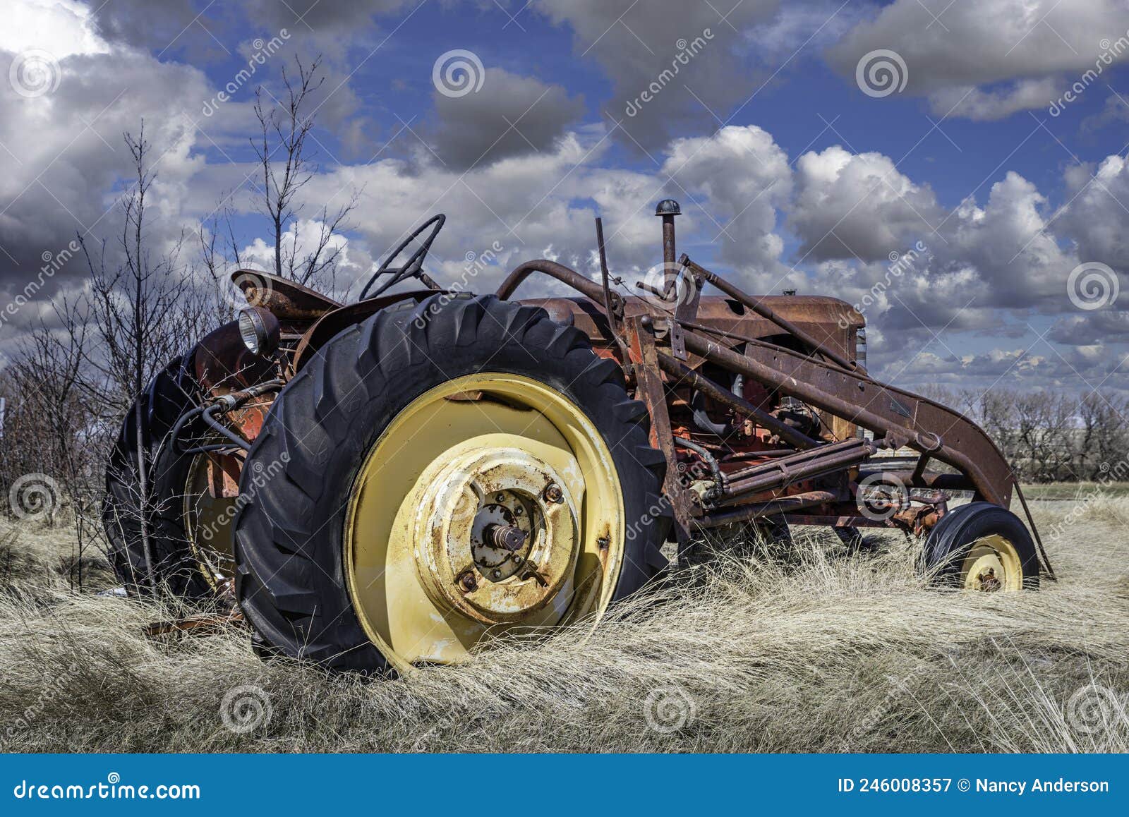 A Vintage Tractor with Front-end Loader on the Saskatchewan Prairies ...