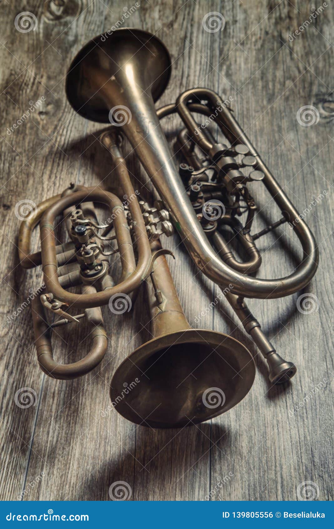 Vintage Trumpets on a Wooden Surface Stock Photo - Image of black ...
