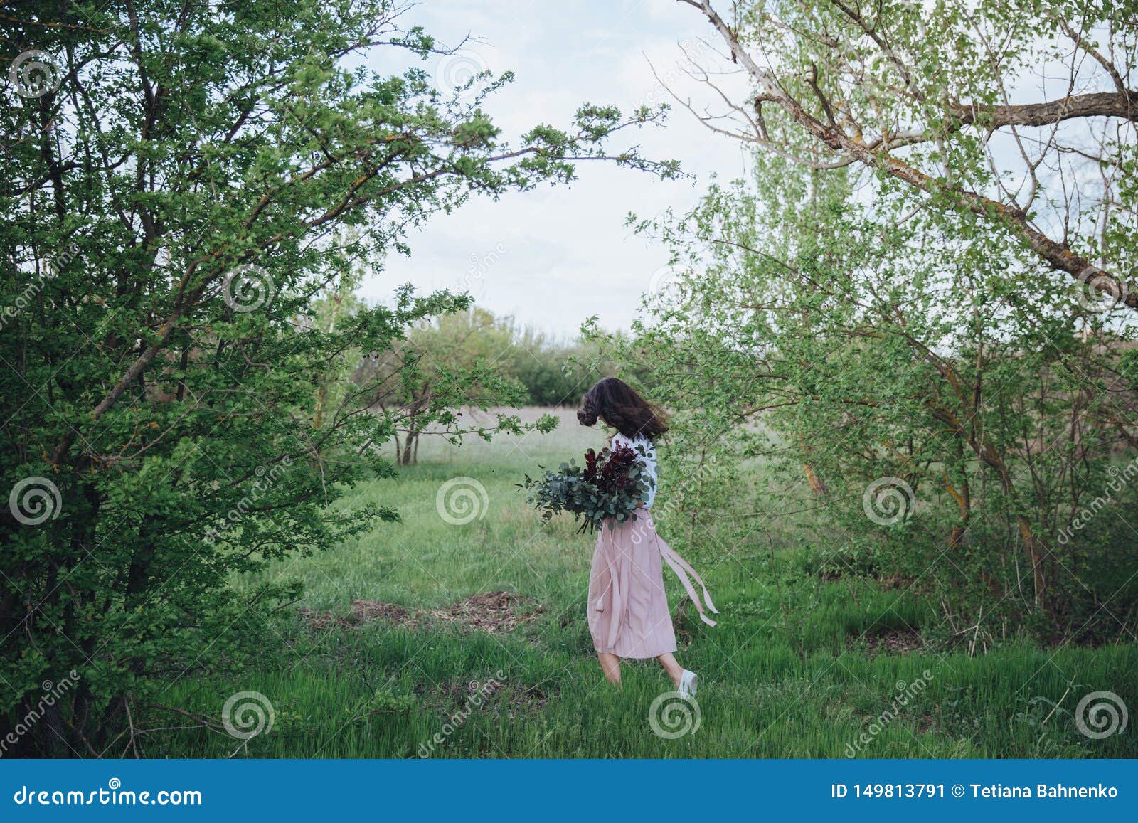Vintage Walking Girl with Greenery Bouquet. Back View Stock Image ...