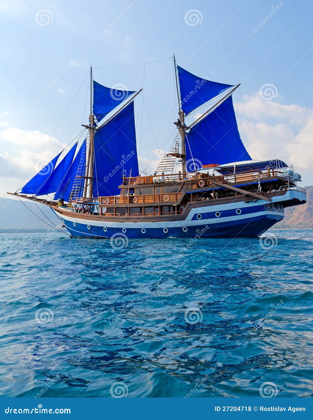 Vintage Wooden Ship with Blue Sails Stock Photo - Image of historical ...