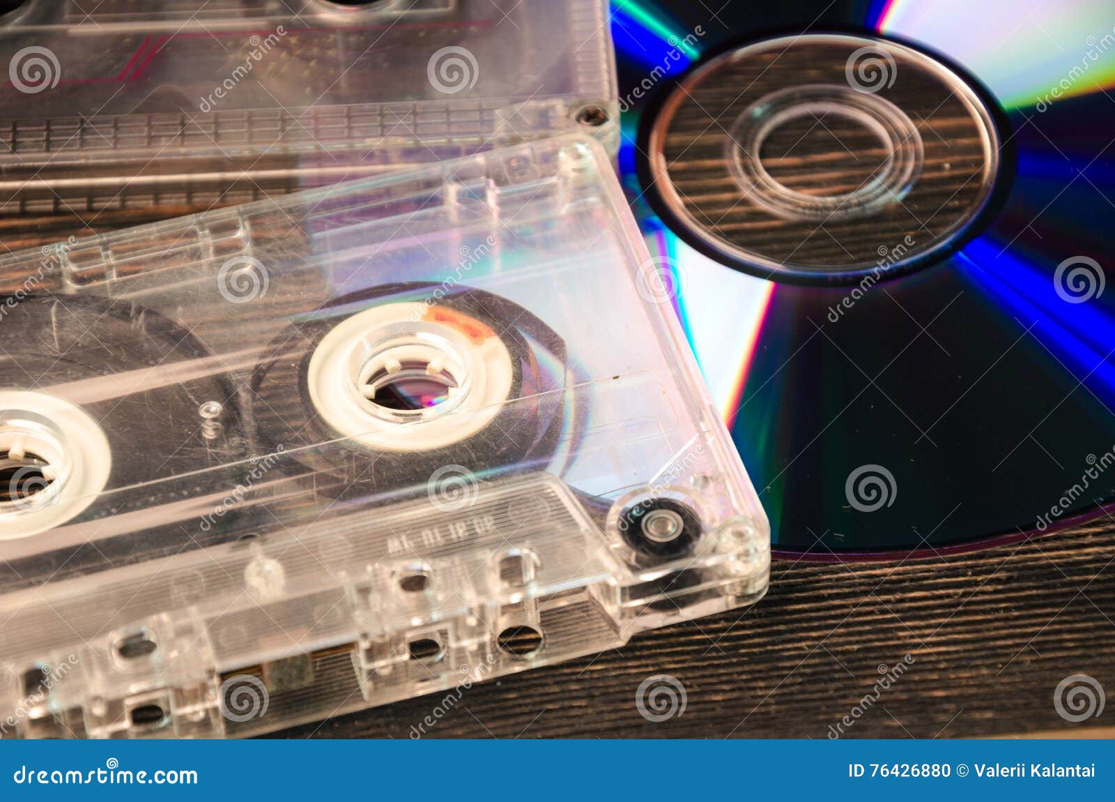 Vinyl Disc and Cassette Tapes on the Wooden Table. Stock Photo - Image ...