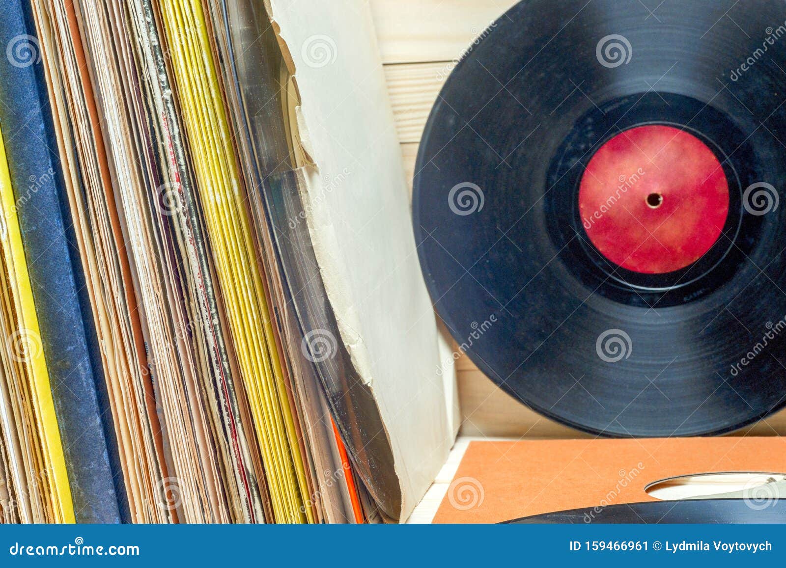 Vinyl Record in Front of a Collection of Albums, Vintage Process. Copy ...