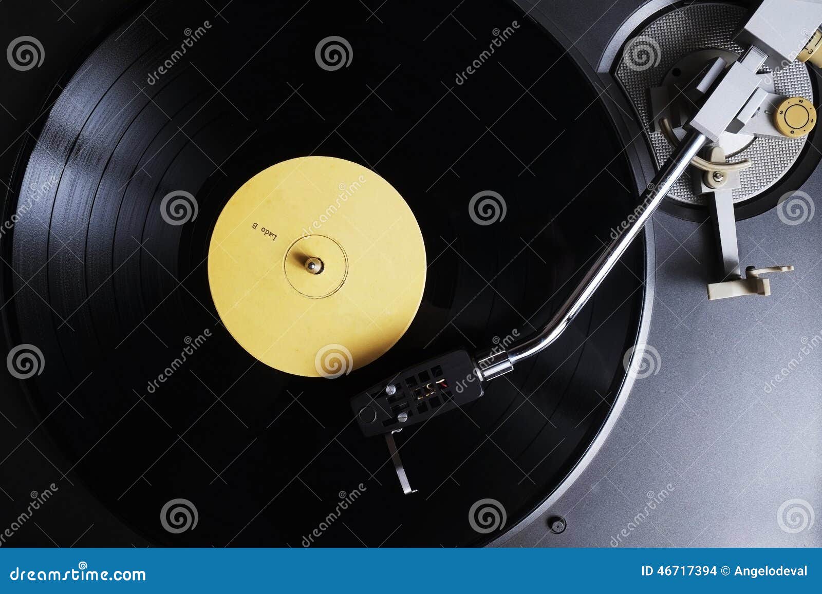 Vinyl Record with Yellow Label Playing on a Turntable Stock Photo ...