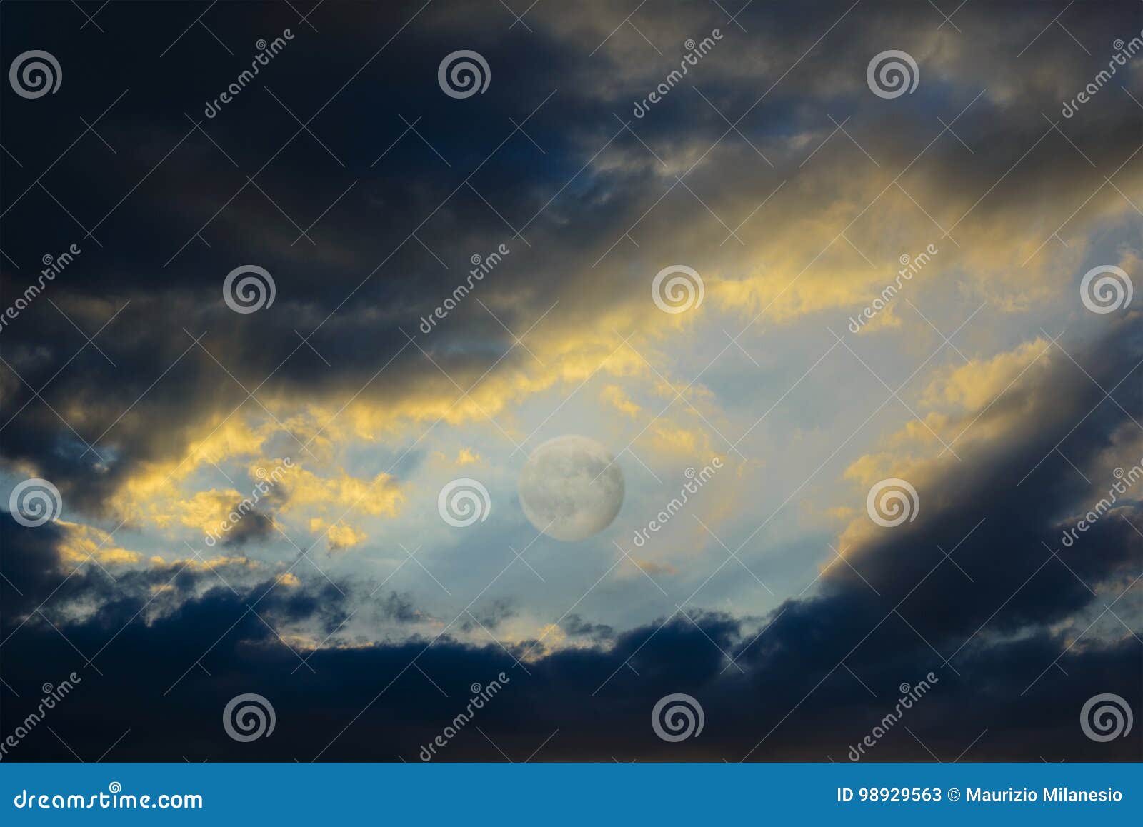 Between the Dark Clouds Backlit by the Sunset There is the Full Stock ...