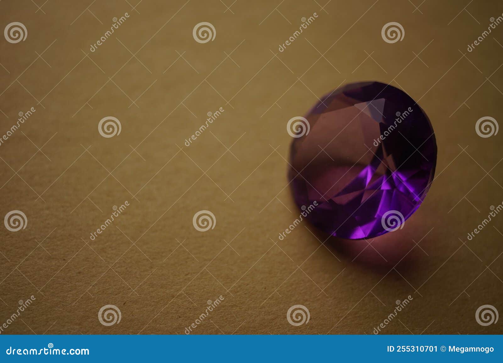Violet Crystal with Facets on a Brown Table Stock Image - Image of ...