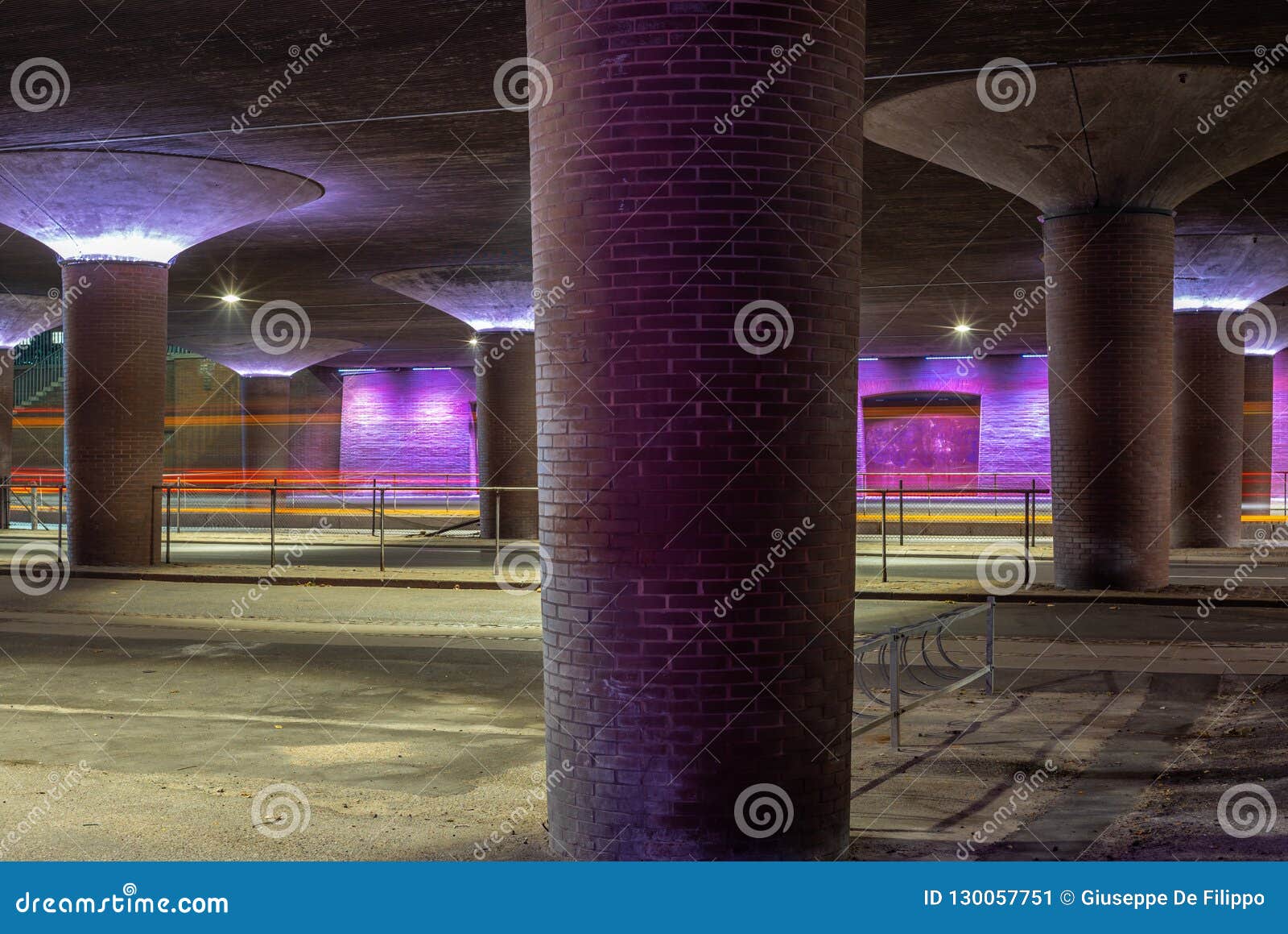 A Violet Illuminated Underpass Below an Highway Bridge in Copenhagen in ...