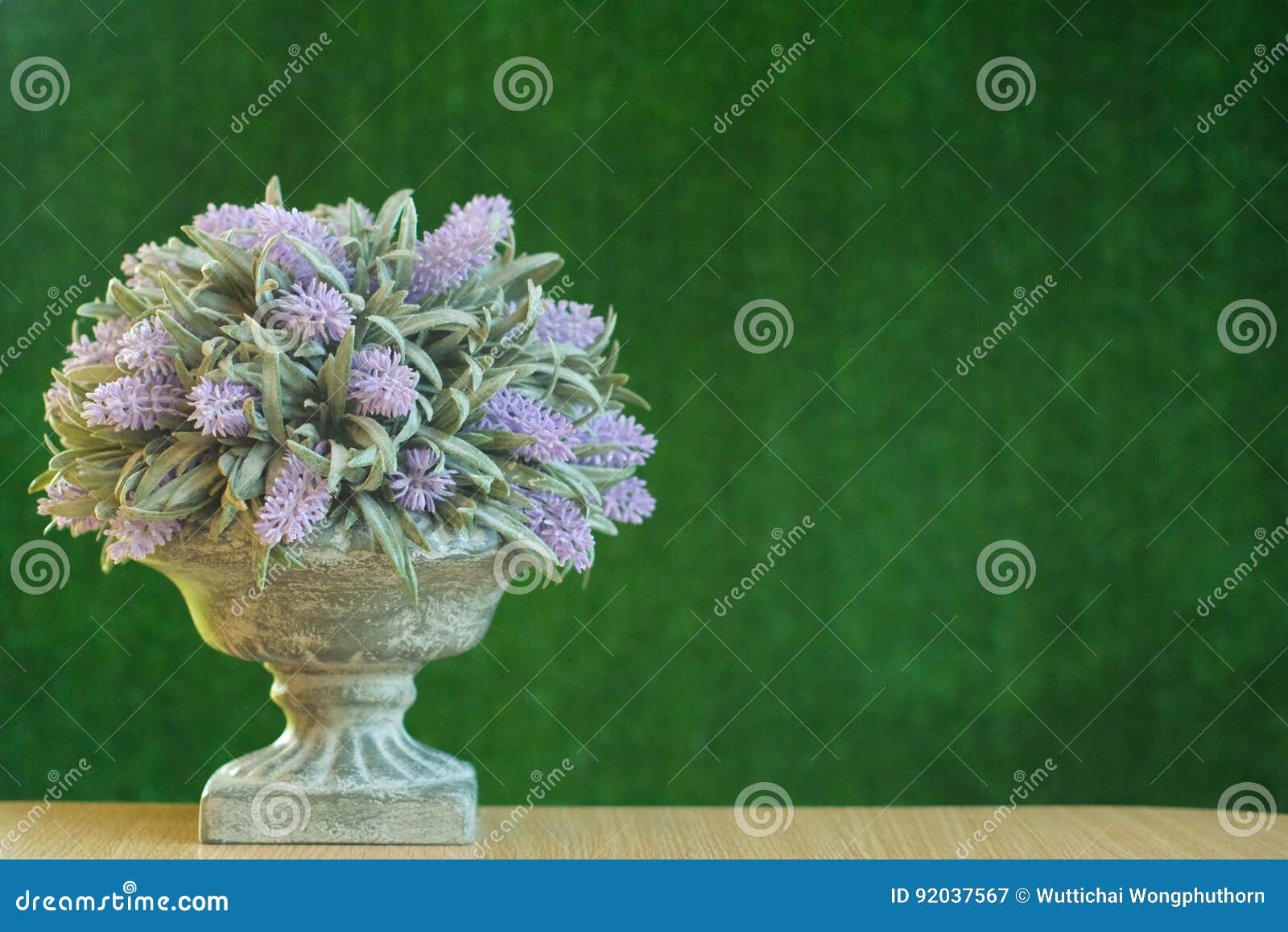 Violet Plastic Flowers on Green Background, Wall, Texture Stock Image ...