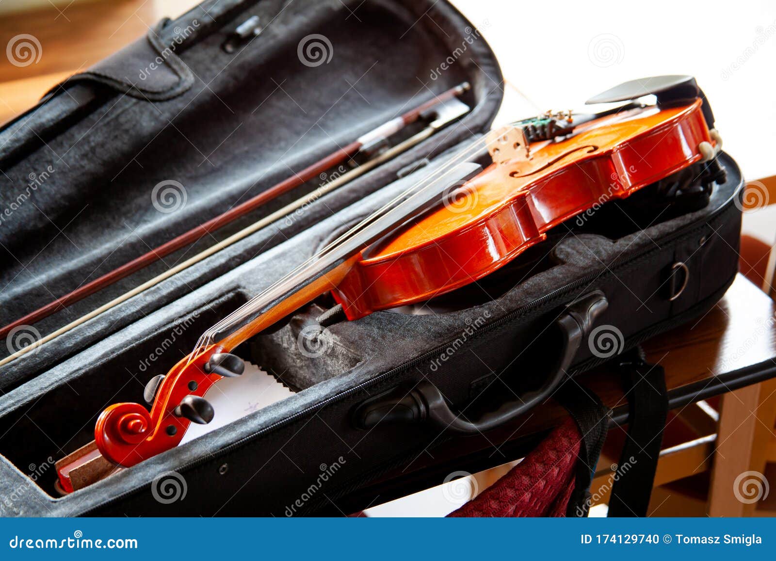 Violin with a Bow Laying in an Open Black Fiddle Case on the Table ...